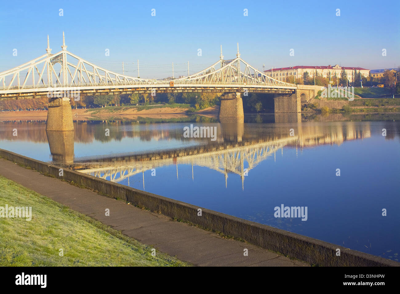 City and the bridge through the river Stock Photo - Alamy