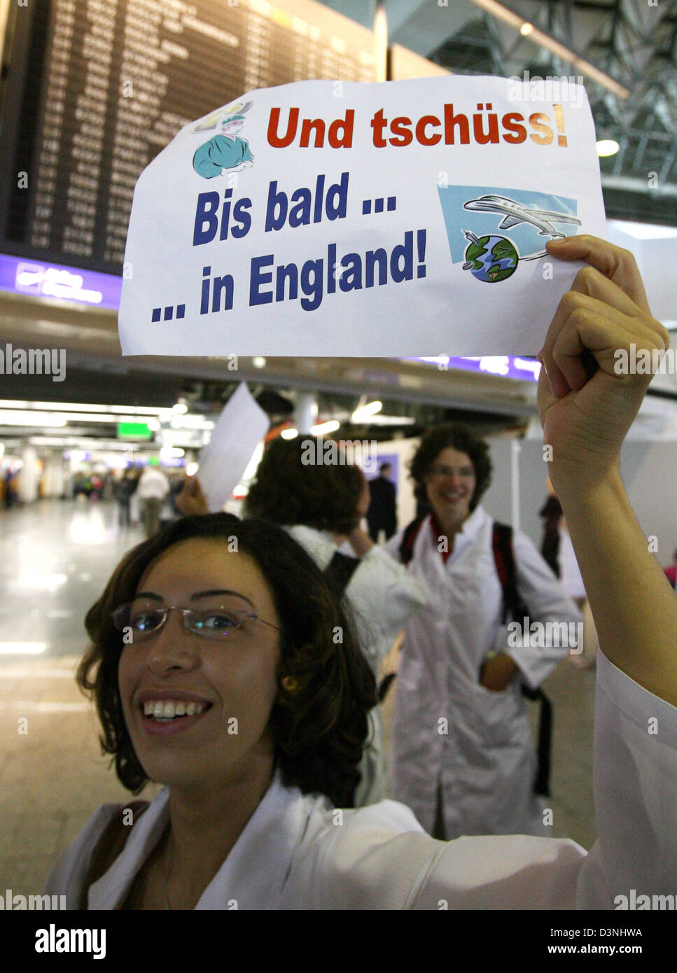 The picture shows a doctor with a protest poster at the airport in ...
