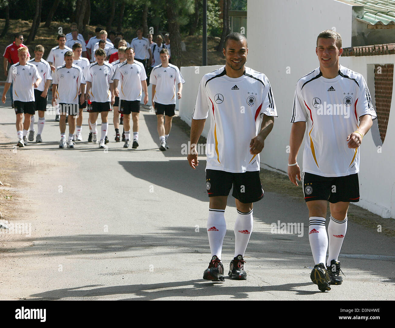 German national soccer team players Lukas Podolski (R) and David ...