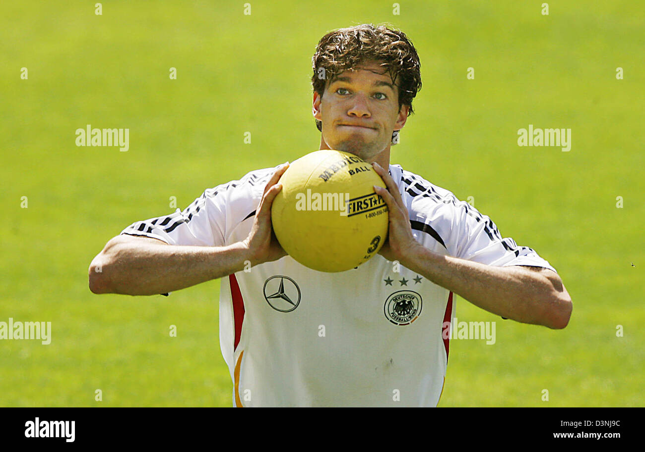German national player Michael Ballack catches the ball in his hands ...