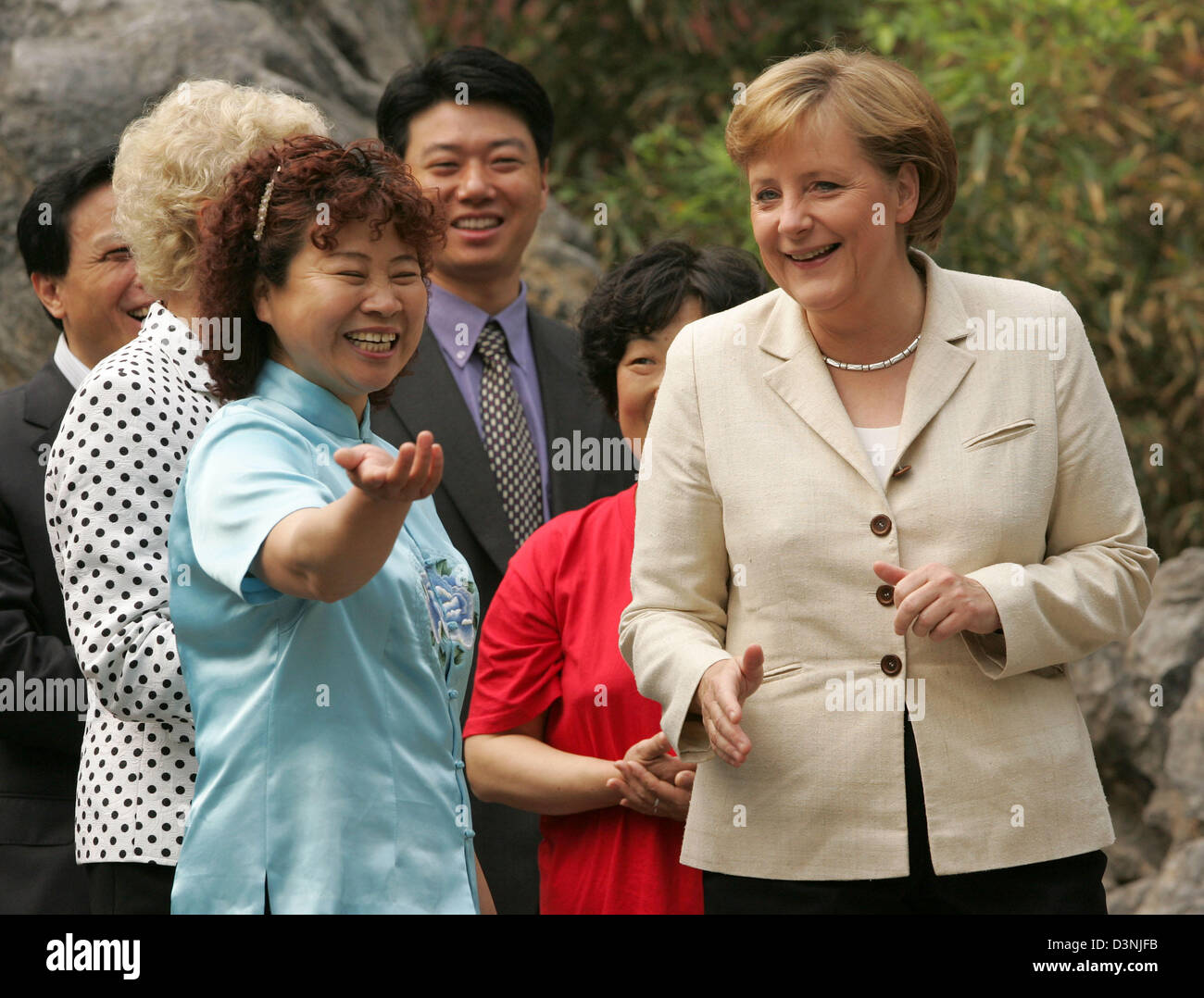 German Chancellor Angel Merkel (CDU) talks to a woman at the Changpuhe ...