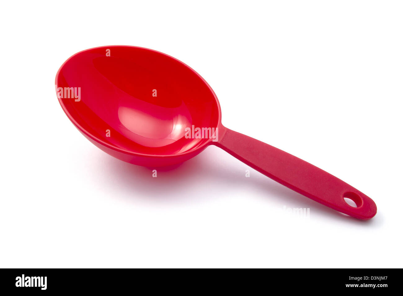 Red measuring spoon closeup on white background Stock Photo - Alamy