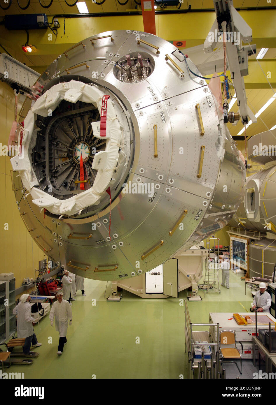 Spacelab 'Columbus' is transfered to a special transport container with ...