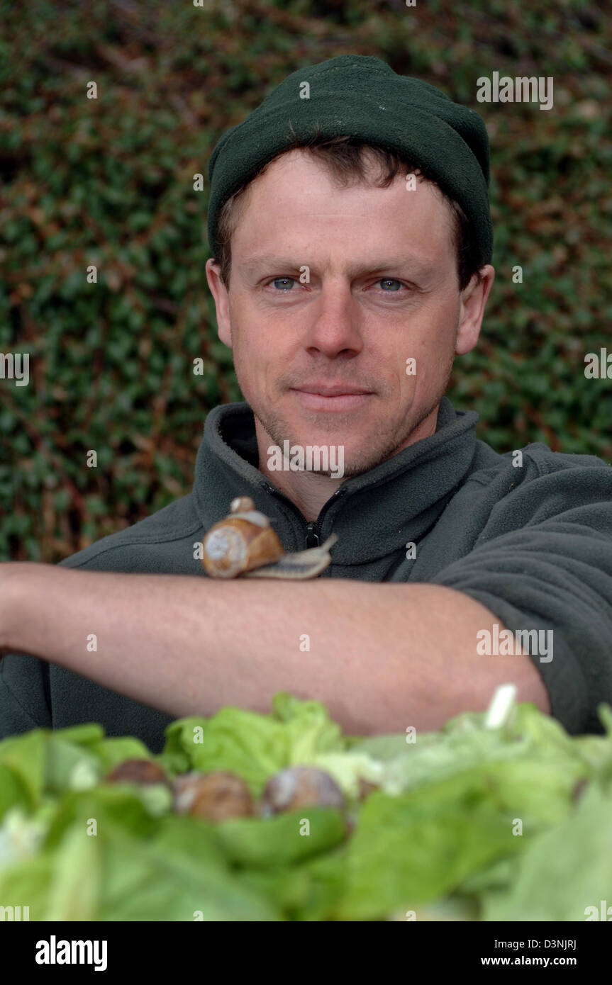A grapevine snail crawls on the arm of Rhineland-Palatinate's first ...