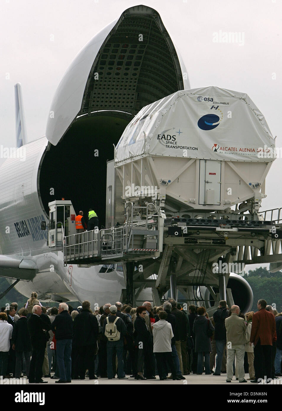 Packed into a transport container spacelab 'Columbus' is being loaded ...