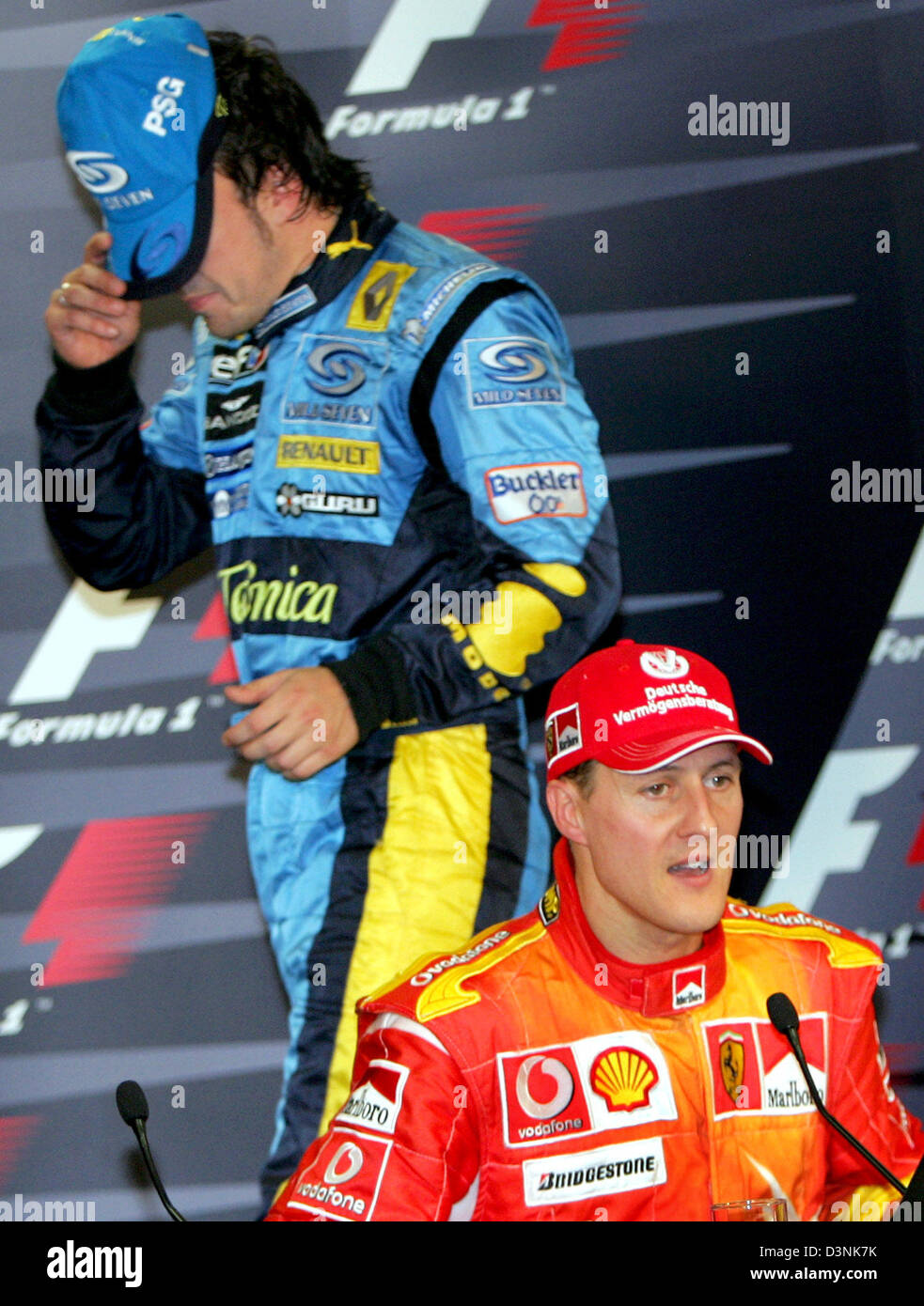 Spanish Formula One driver Fernando Alonso (rear) for Renault F1 team ...