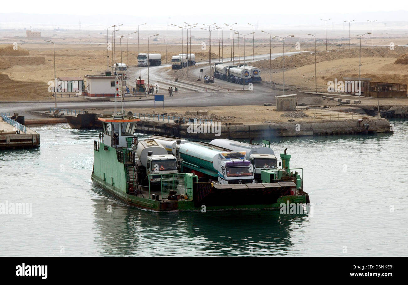 A ferry transports petrol trucks over the Suez Canal, Egypt, 17 April ...