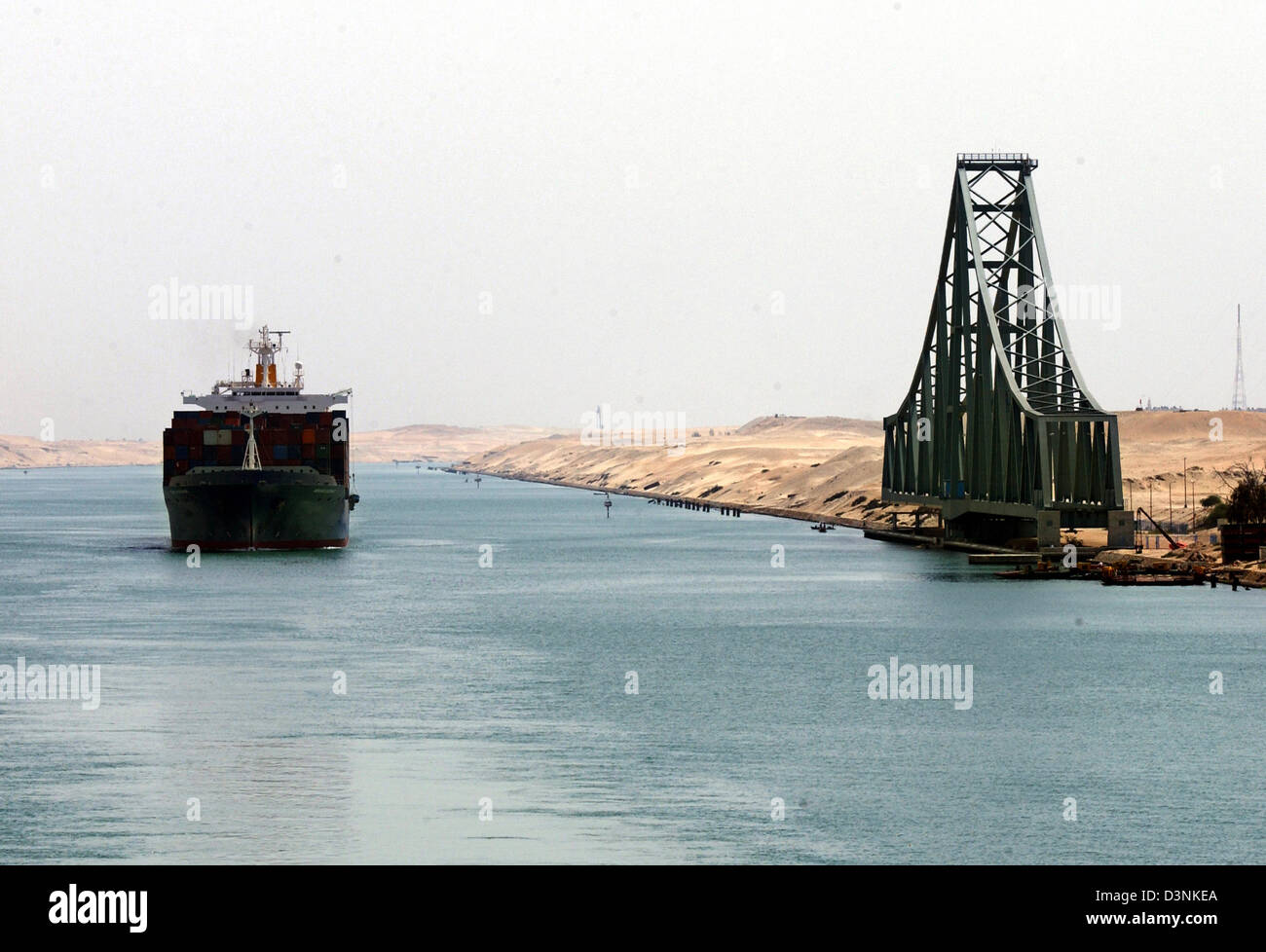 A container ship passes the world's biggest swing bridge El Ferdan at the Suez Canal, Egypt, 17 ...