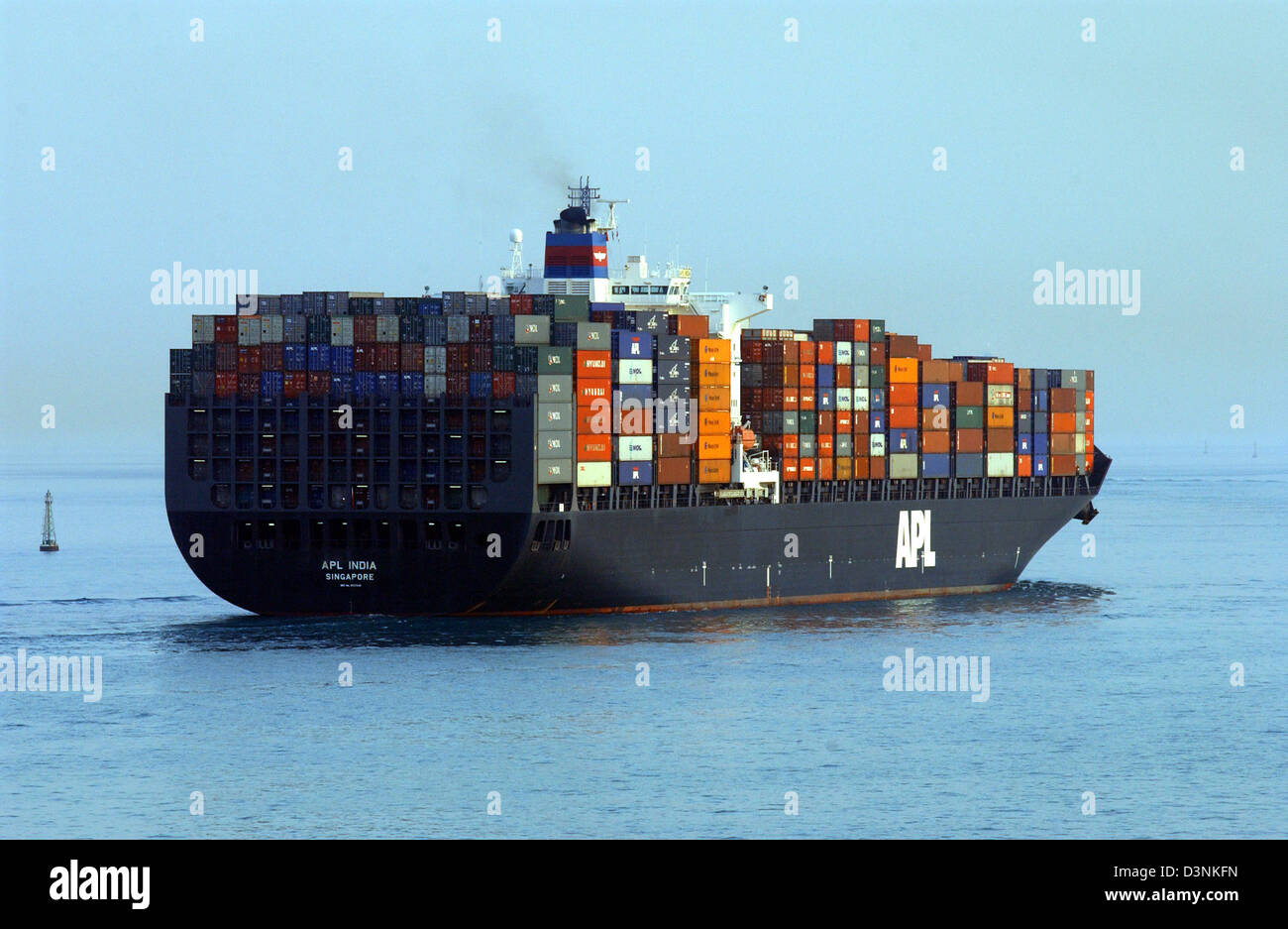 A container ship exits the Suez Canal near Suez, Egypt, 17 April 2006 ...