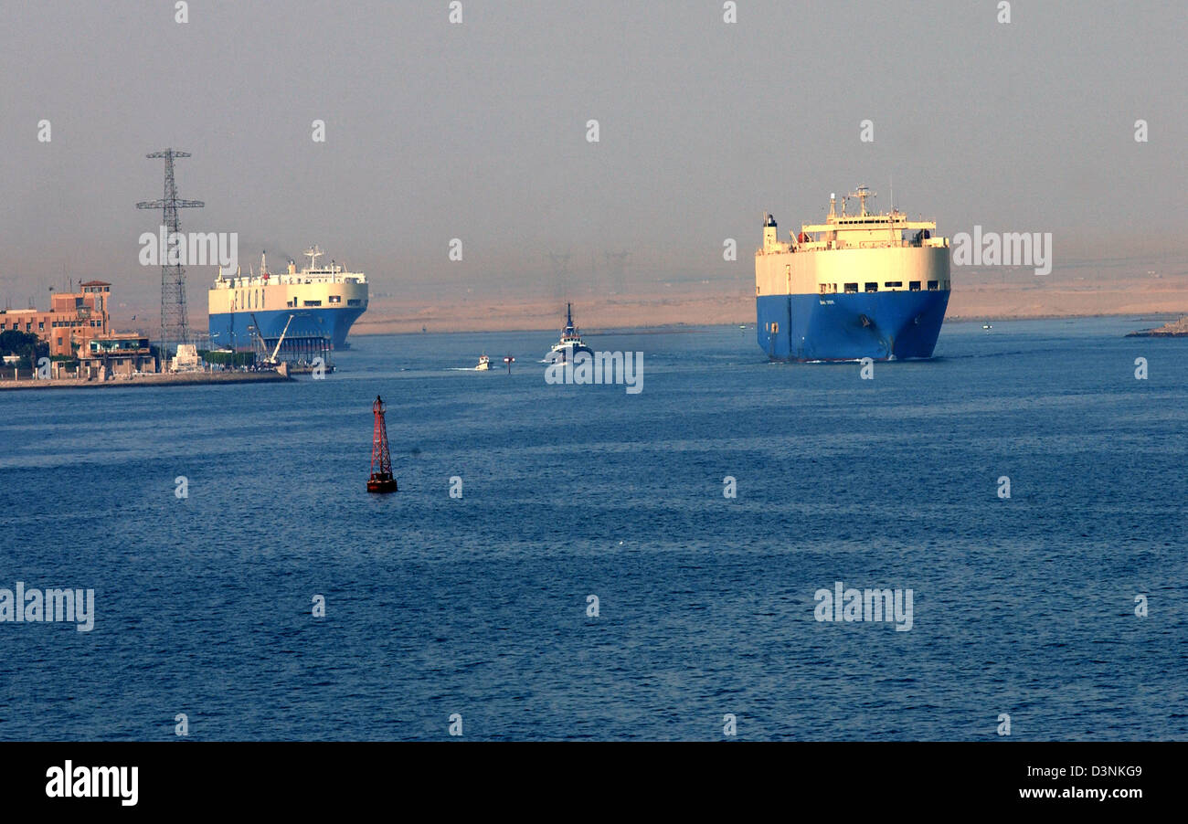 Two container ships exit the Suez Canal near Suez, Egypt, 17 April 2006 ...