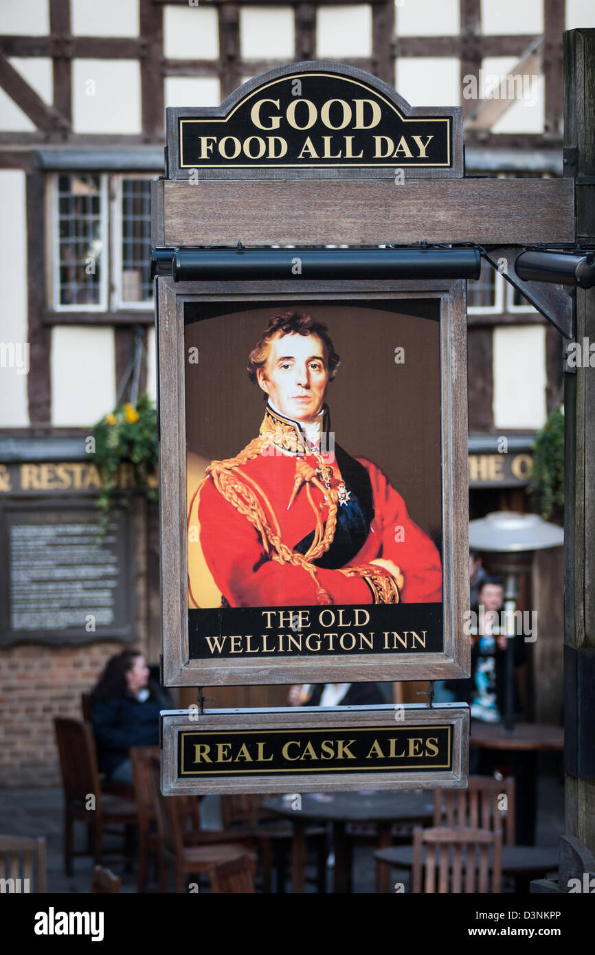 The Old Wellington Inn Pub Sign in Shambles Square, Manchester Stock ...