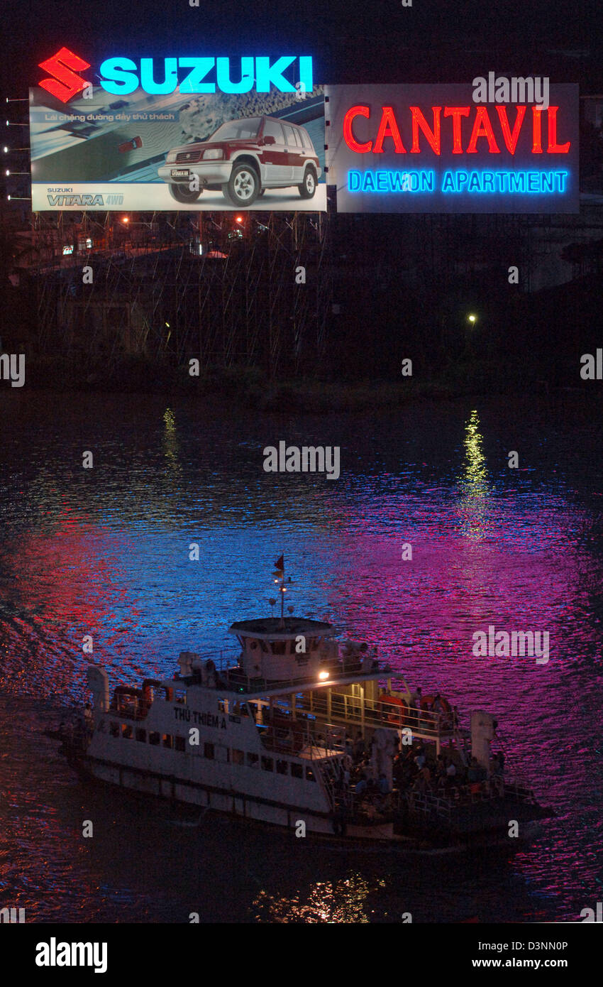 (dpa file) - Neon signs of the companies Suzuki and illuminate the ...