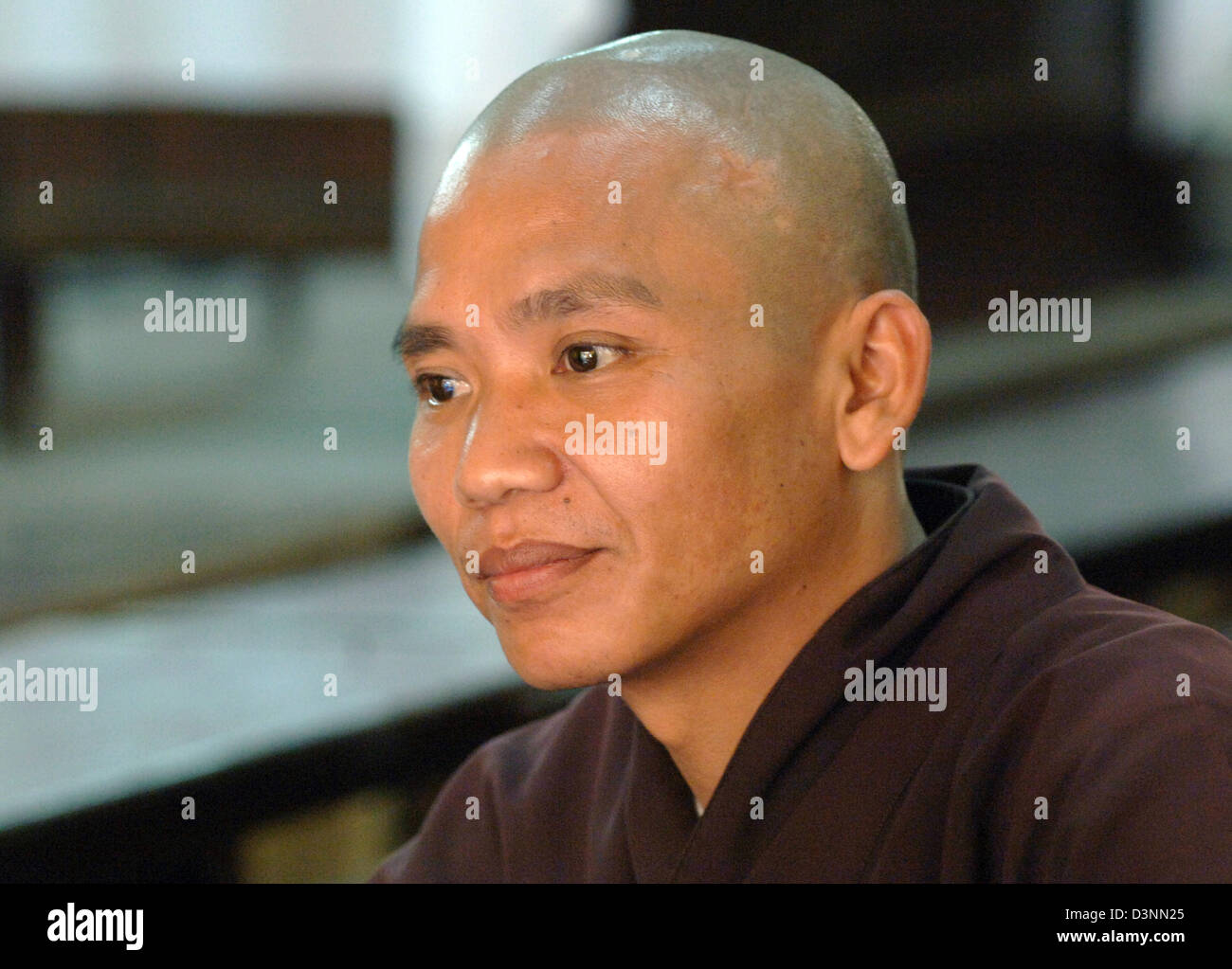 A young buddhist monk waits for the lessons to begin in the Vinh Nghiem ...