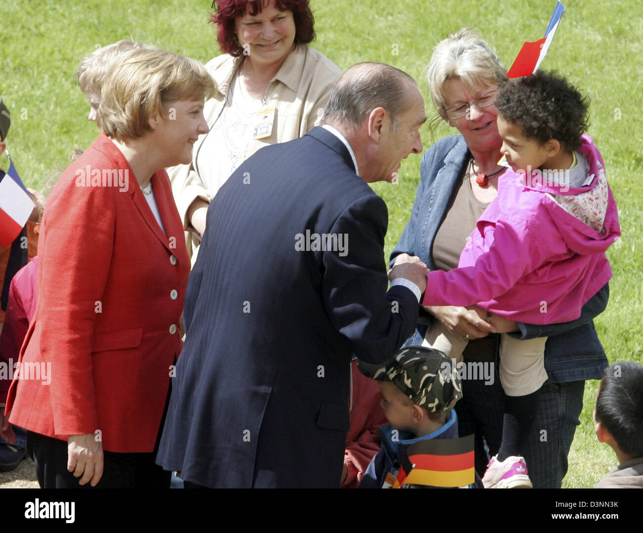 French President Jacques Chirac (C) and German Chancellor Angela Merkel ...