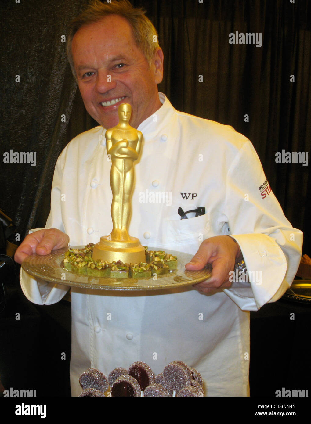 Austrian celebrity chef Wolfgang Puck holds a chocolate Academy Award ...