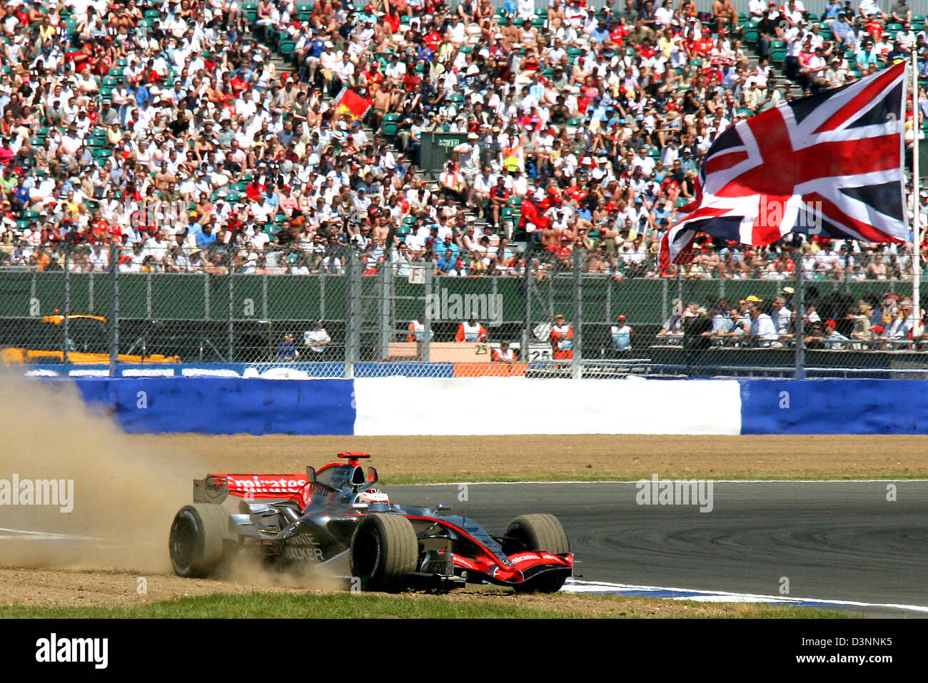 Finnish Formula One pilot Kimi Raikkonen of McLaren Mercedes skids off ...