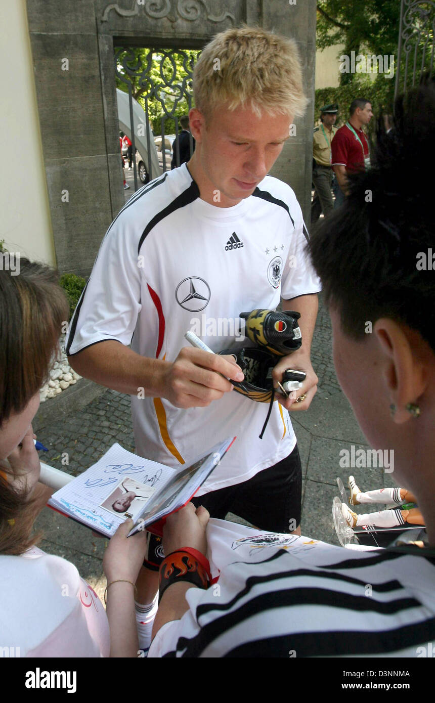 German international Mike Hanke signs autographs for the fans at the ...