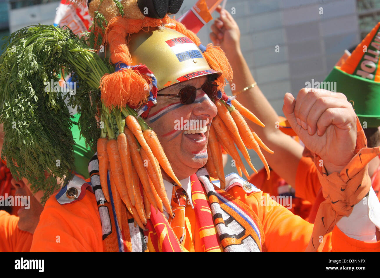 A Dutch soccer fan decorated with carots celebrates in downtown Leipzig ...