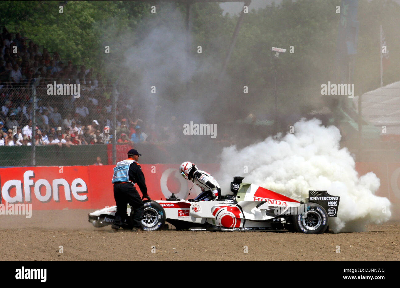 Britain's Jensen Button gets out of his car during the British Grand ...