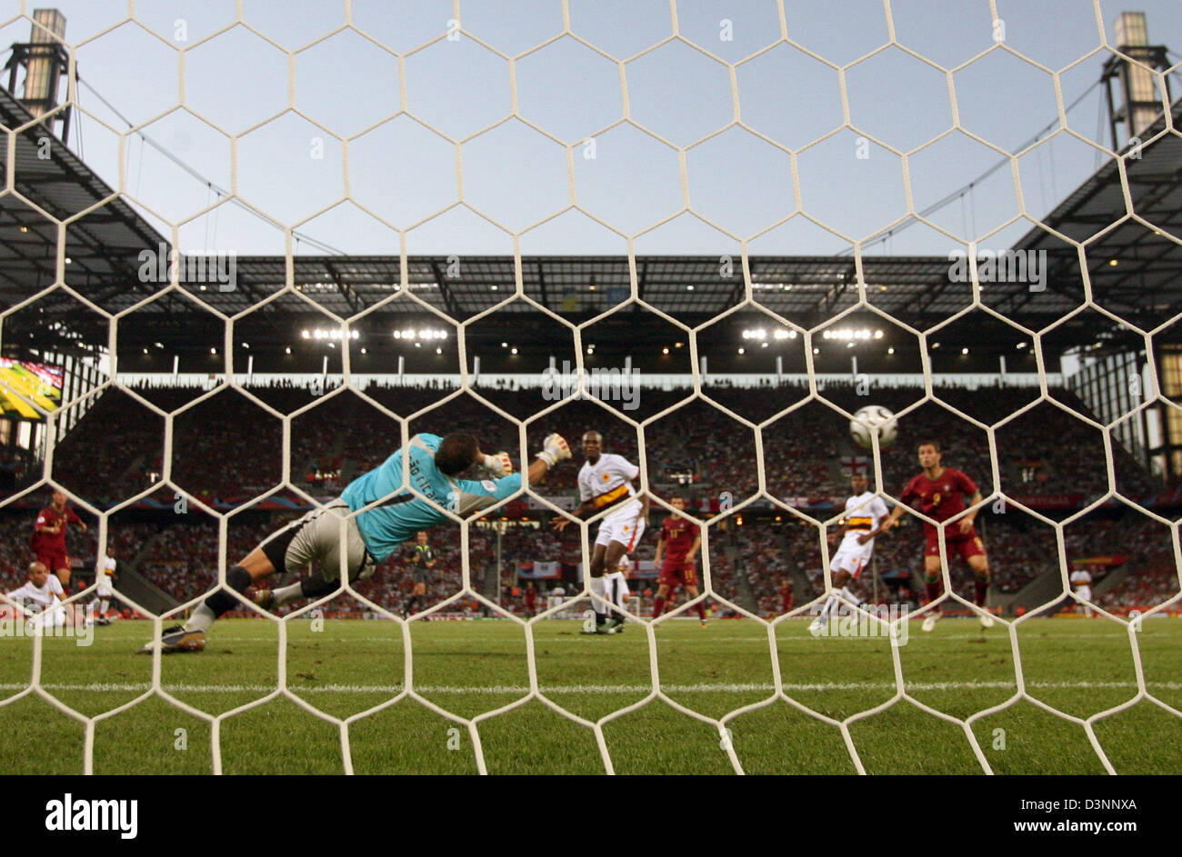 Goalkeeper Ricardo Joao from Angola dives for the ball during the group ...