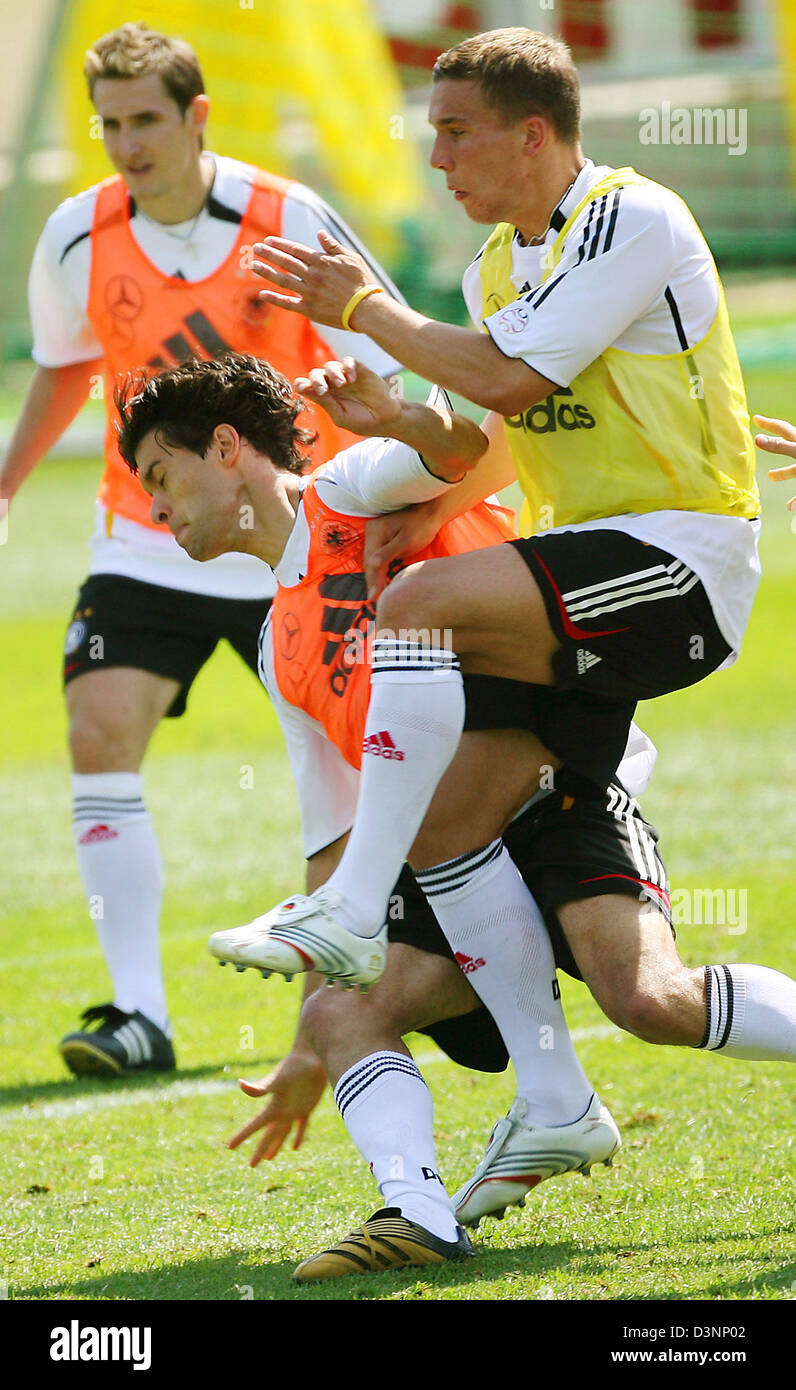 German national player Michael Ballack (C), Lukas Podolski (R) and ...