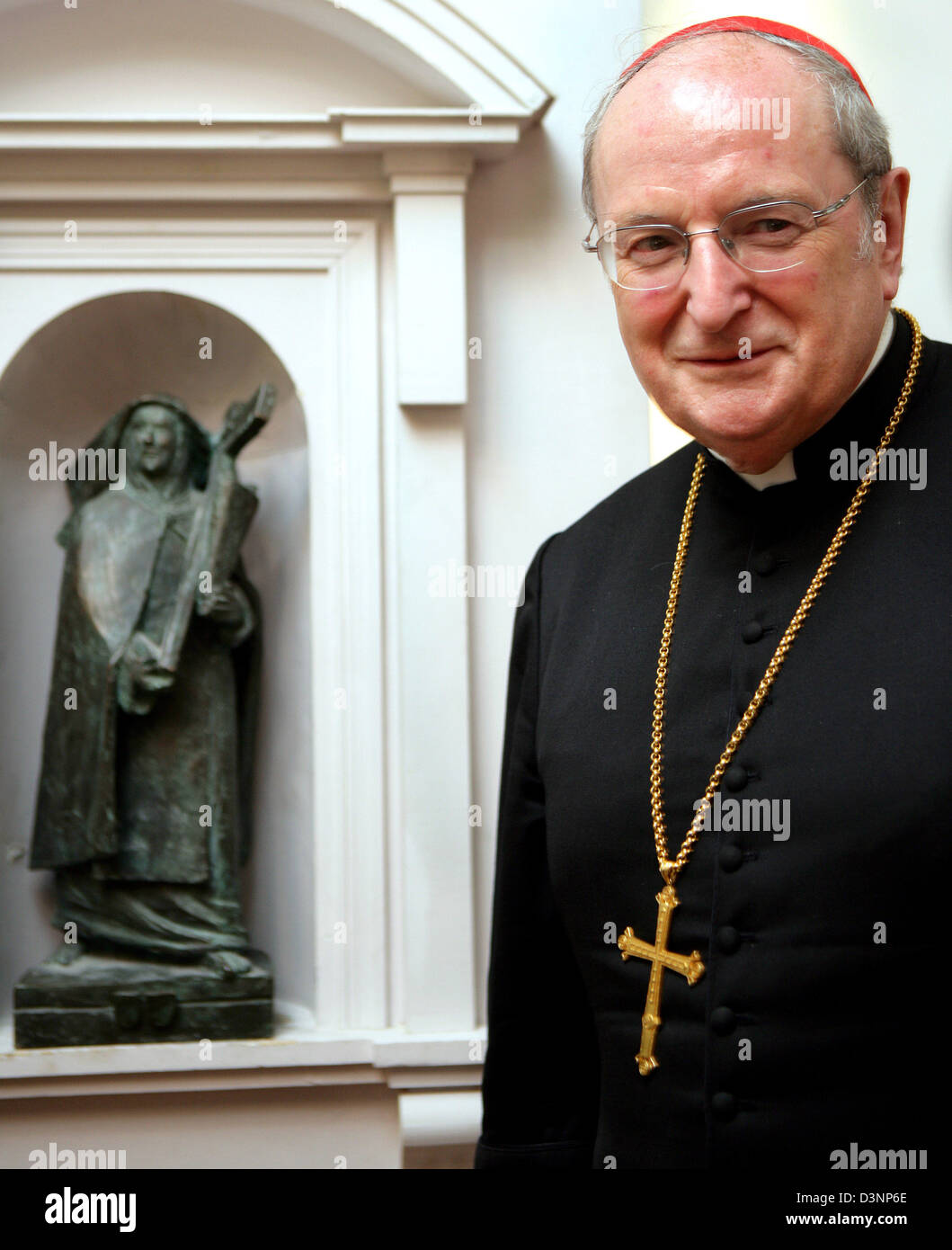 Archbishop Joachim Cardinal Meisner stands in front of a small-size ...