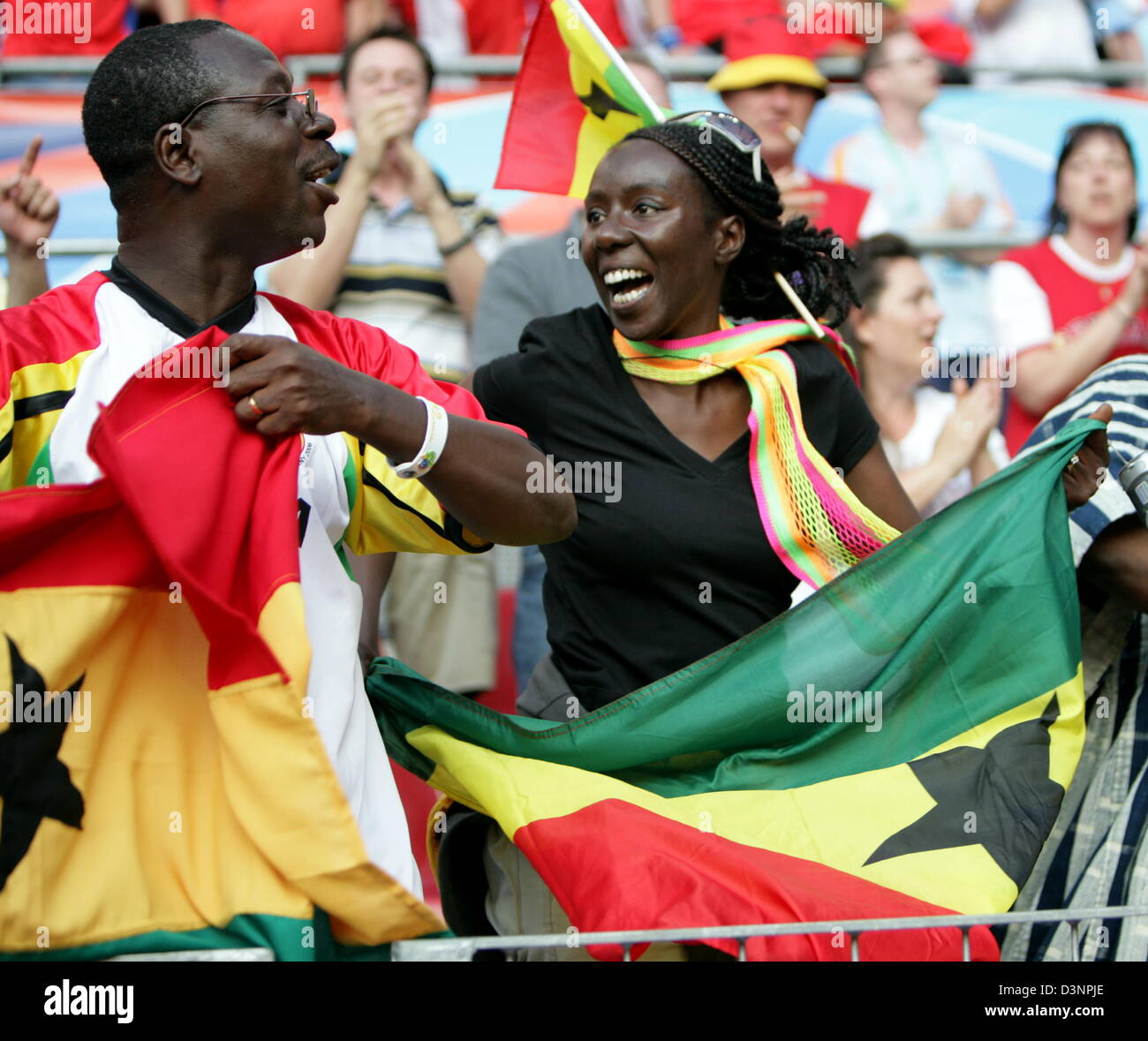 Supporters from Ghana celebrate the victory of their team after the ...
