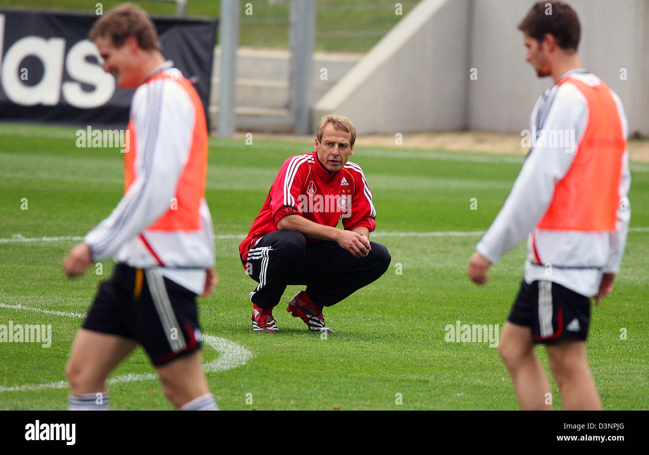 German national coach Juergen Klinsmann (C) watches his players Robert ...