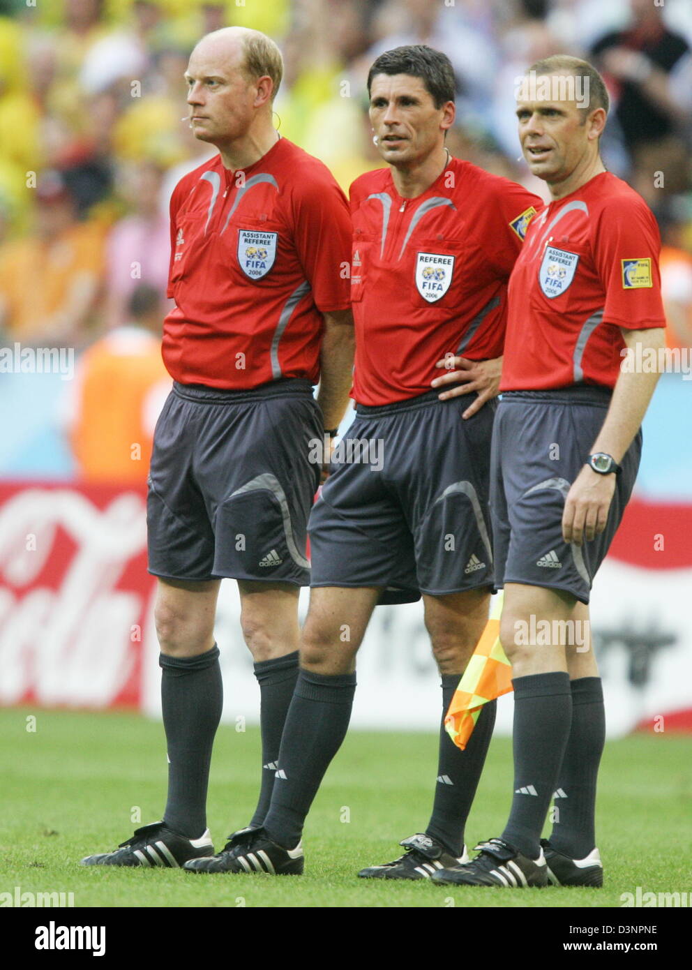 The photo shows the German referee Markus Merk (C) with his assistants ...