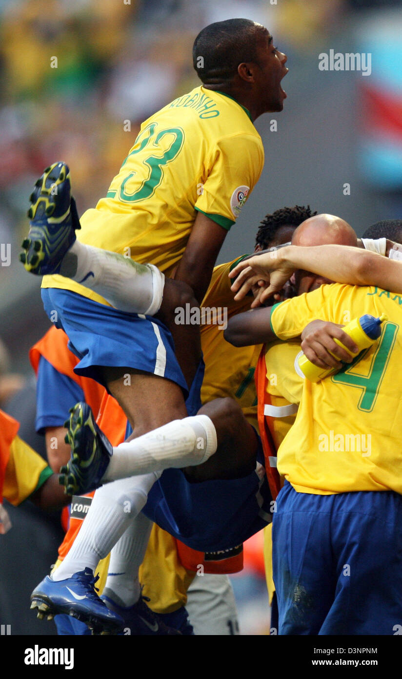 Robinho of Brazil (L) celebrates on the shoulders of his team-mates ...