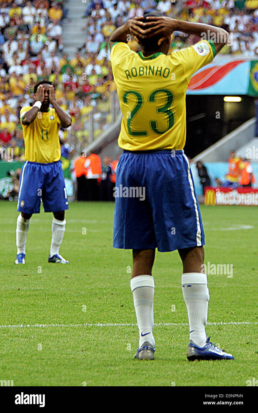 Ze Roberto (L) and Robinho of Brazil stand on the pitch during the ...