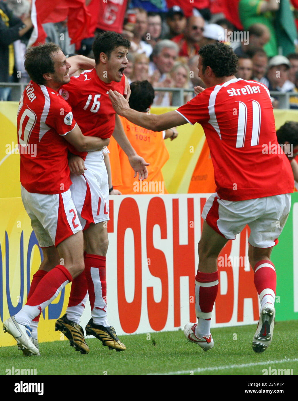 Tranquillo Barnetta (C) from Switzerland is celebrated by teammates ...