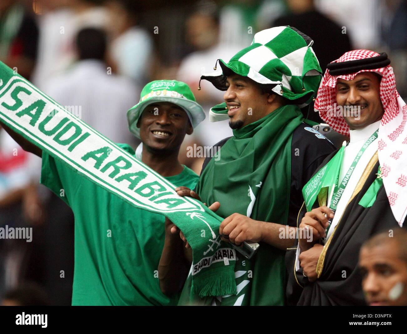 Supporters of the Team from Saudi Arabia cheer prior to the group H ...