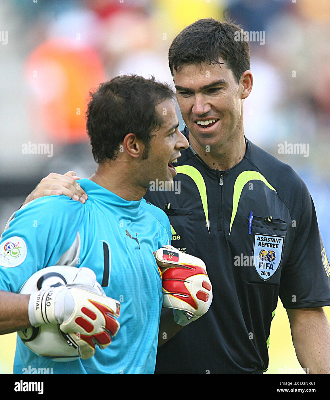 The goalkeeper of Angola Joao Ricardo (L) and the referee Mark Shields ...