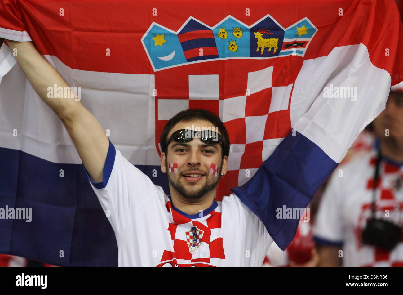 A Croatian supporter raises the flag prior to the group F match of the ...