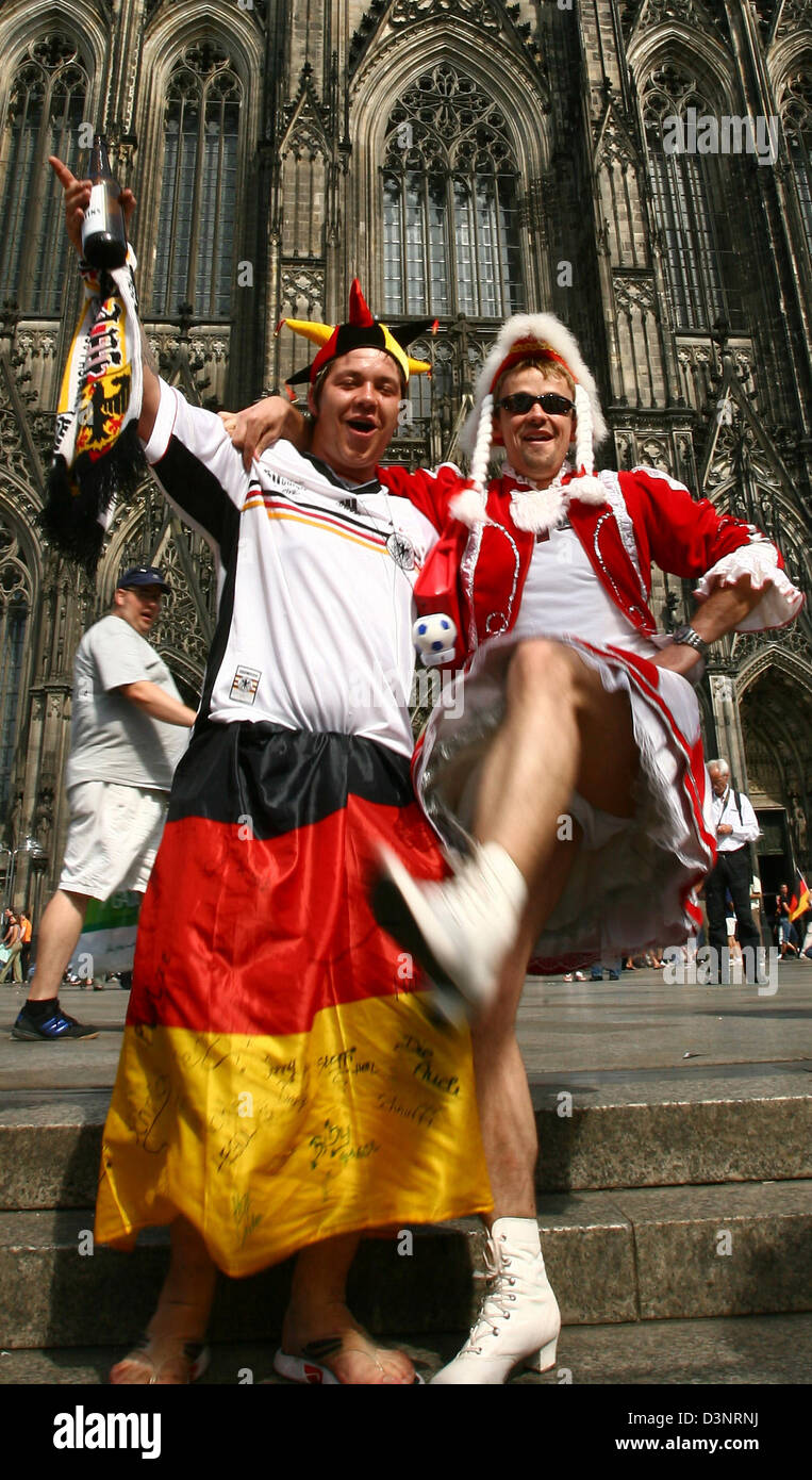 German supporters dance in a carnival costume of a "Tanzmariechen" in ...