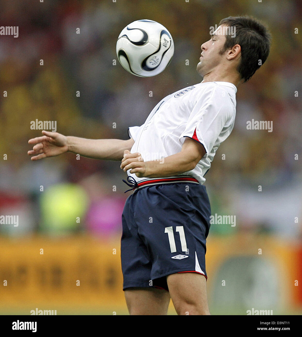 England's national soccer player Joe Cole controlls the ball during the ...