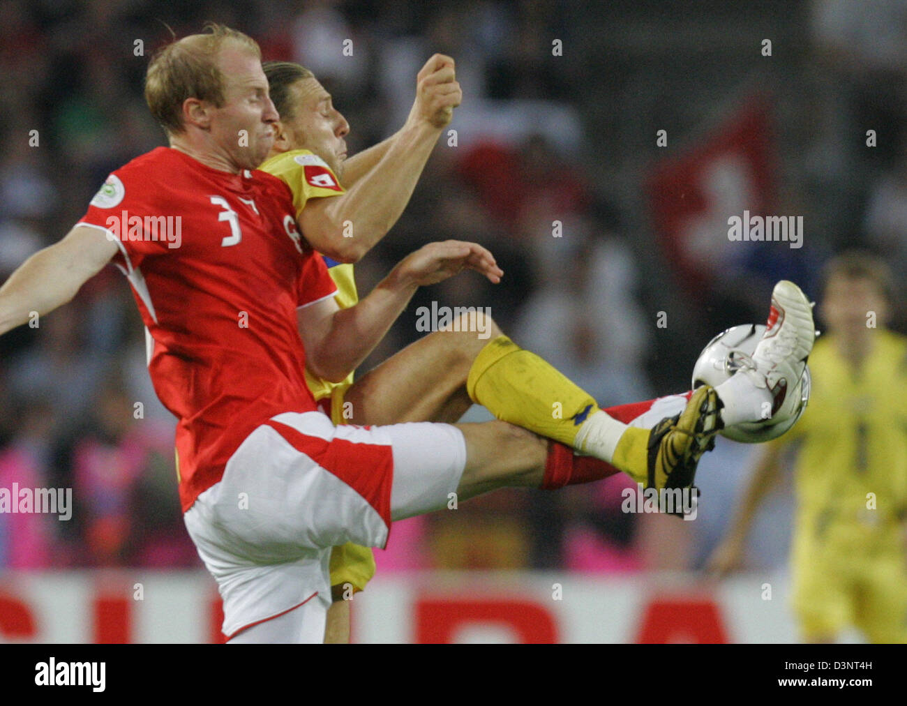 Swiss national soccer player Ludovic Magnin (L) vies for the ball with ...