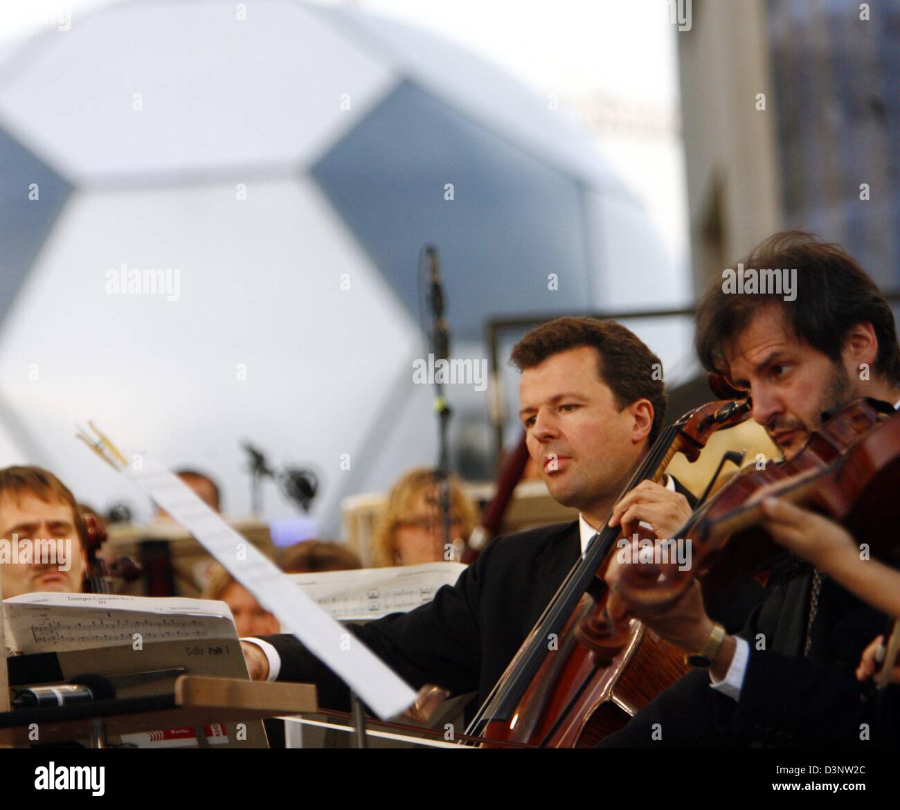 Members of the Berlin Philharmonic Orchestra play their instruments in ...