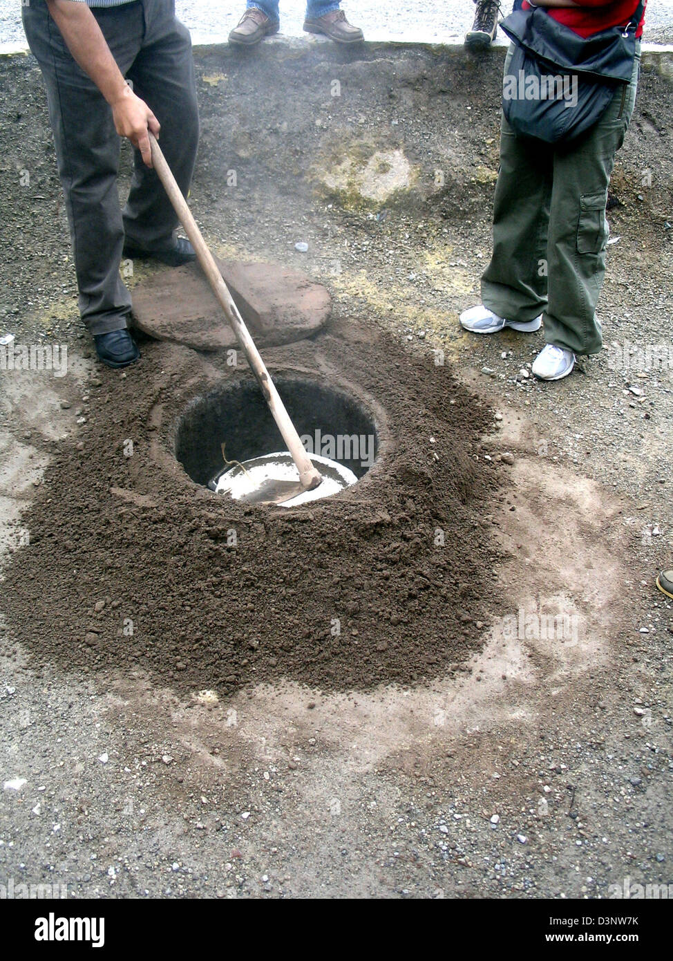 (dpa file) - A pot with cooked stew is taken fron the soil on the ...
