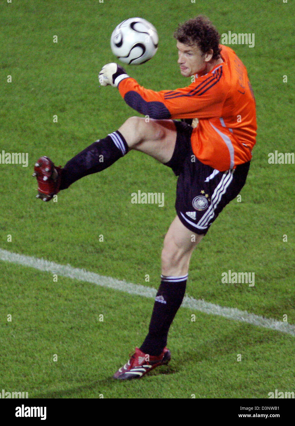 German goal keeper Jens Lehmann goes for the ball during the semi-final ...