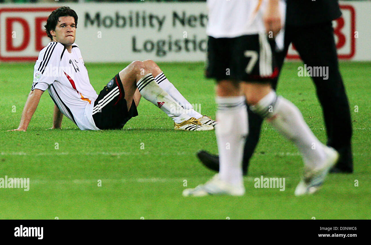 Dejected German player Michael Ballack sits on the pitch after the ...