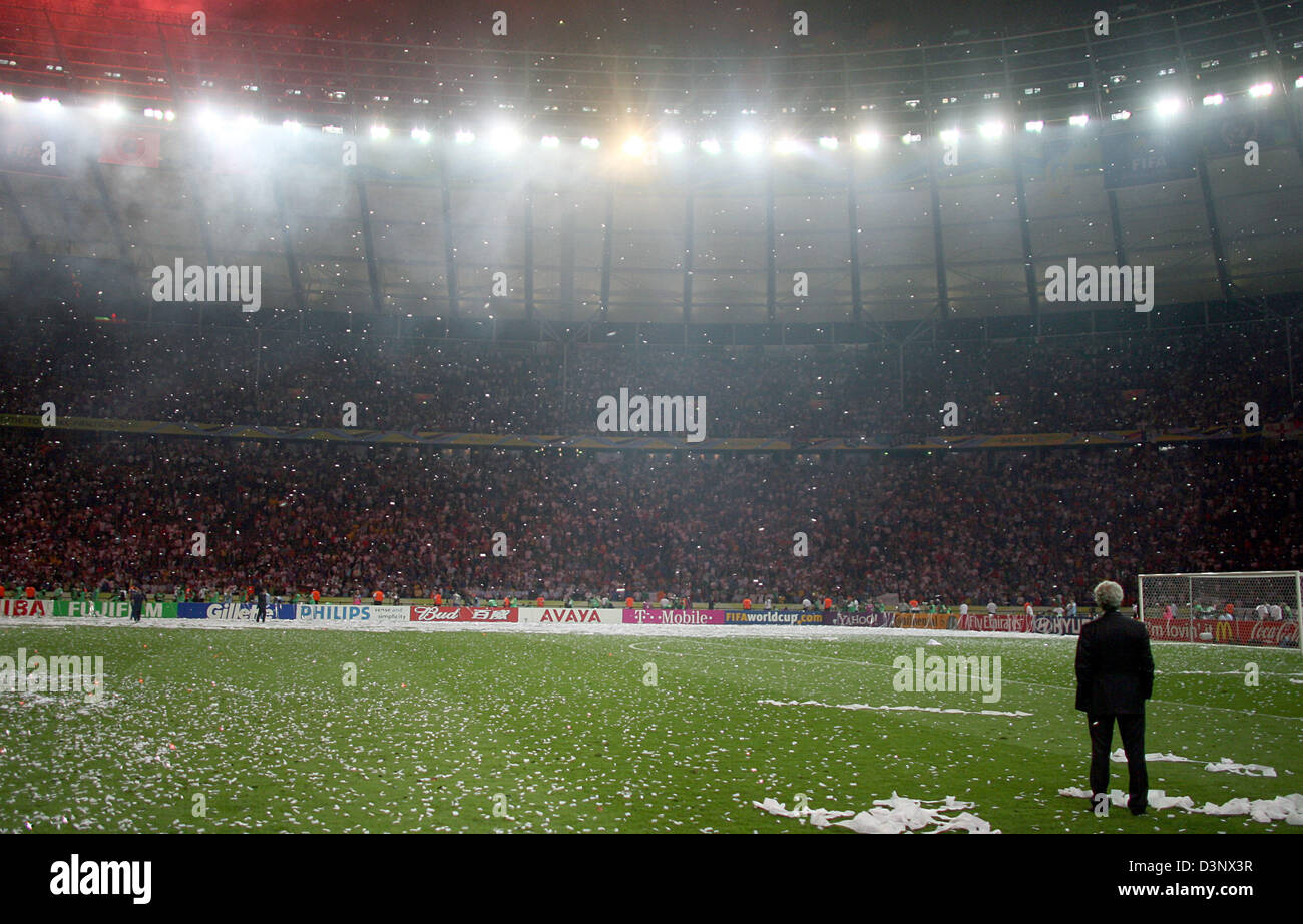 Dejected national coach Raymond Domenech from France stands alone on ...