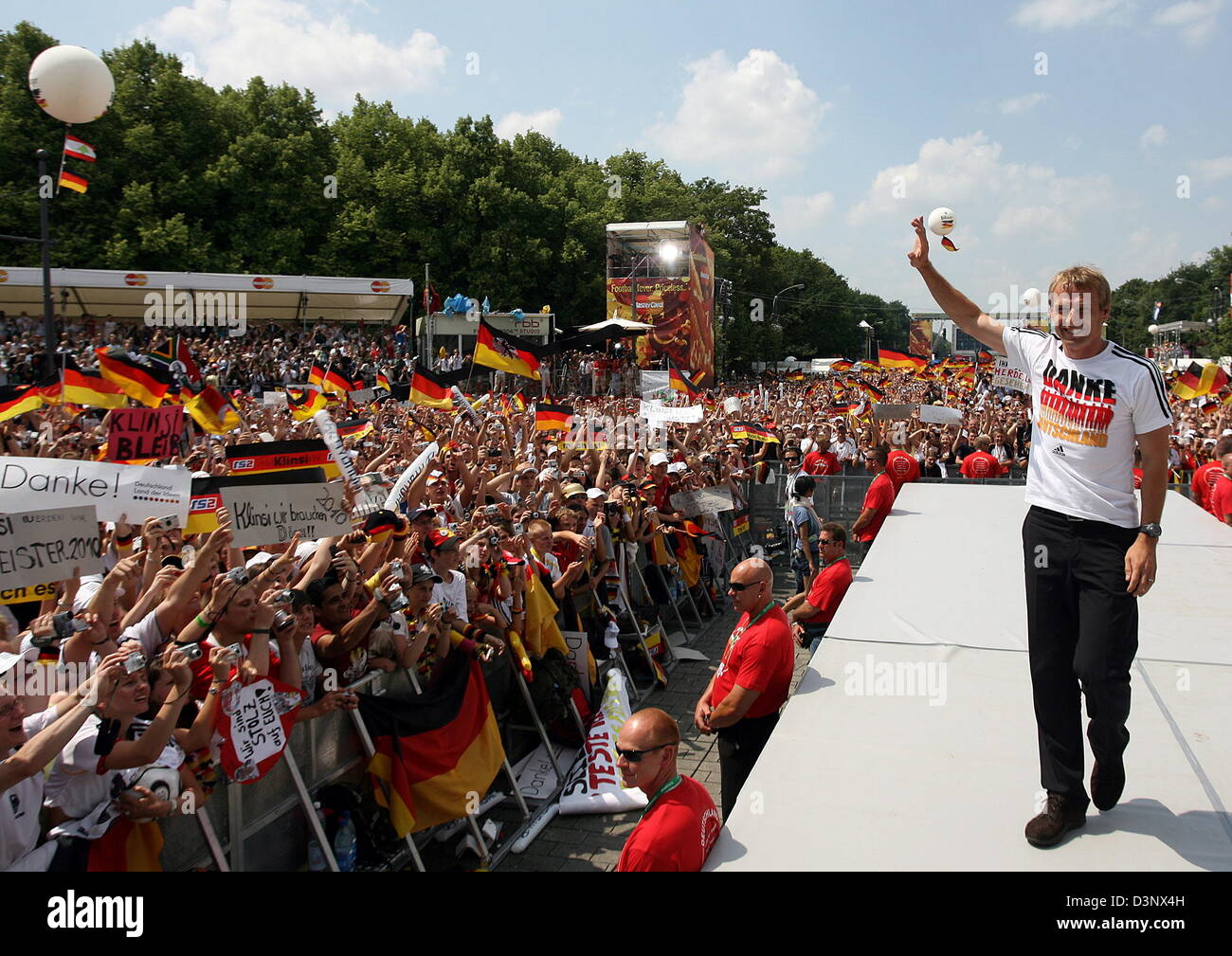 German coach Juergen Klinsmann waves to the fans at the Fan Mile in ...
