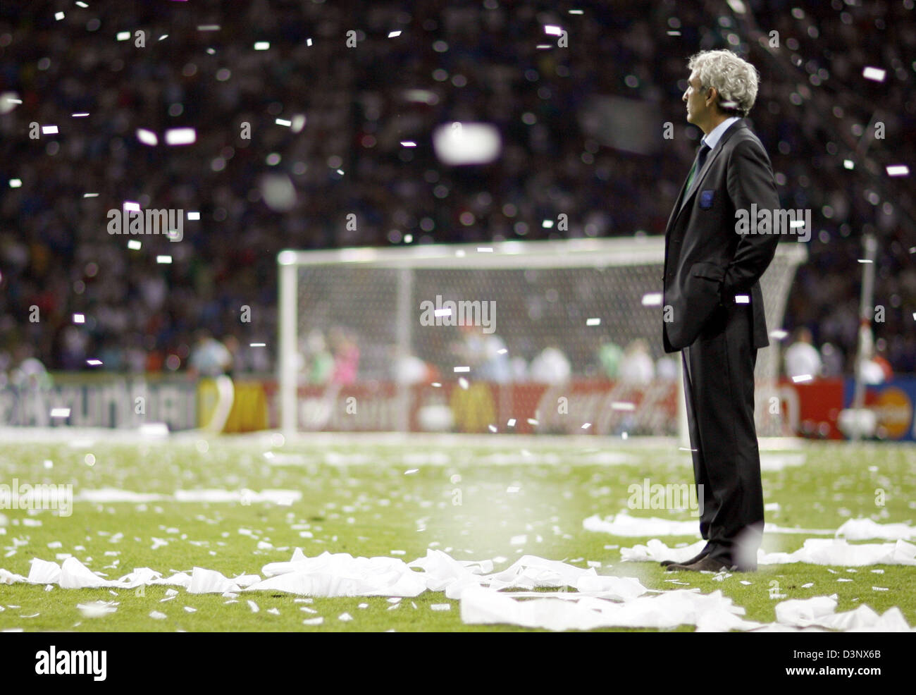 Dejected national coach Raymond Domenech from France stands alone on ...