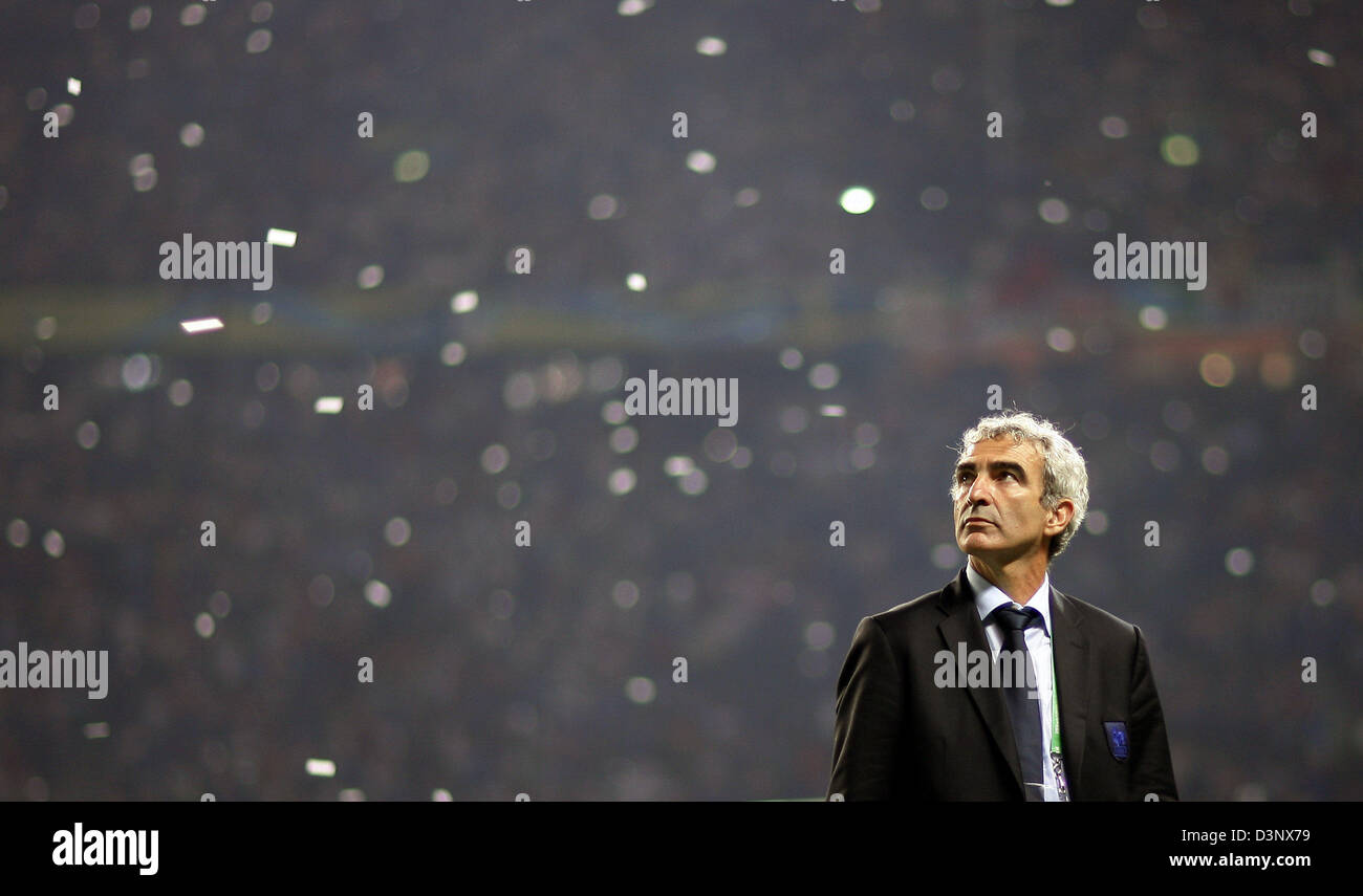 Dejected national coach Raymond Domenech from France stands alone on ...