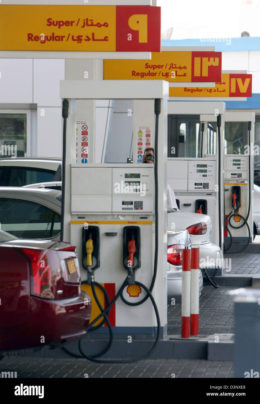 The picture shows cars in front of petrol pumps at a Shell fuelling ...