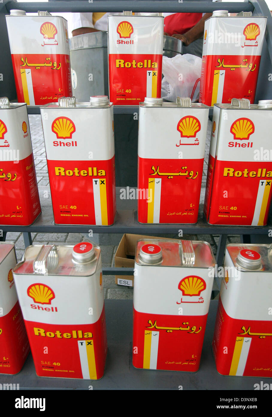 The picture shows tin cans filled with engine oil for motor cars on the ...