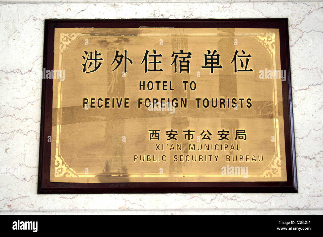 A sign that reads 'Hotel to receive foreign tourists' is located at a ...