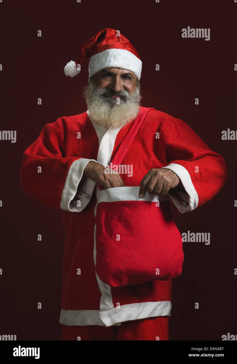 Santa taking presents out bag hi-res stock photography and images - Alamy